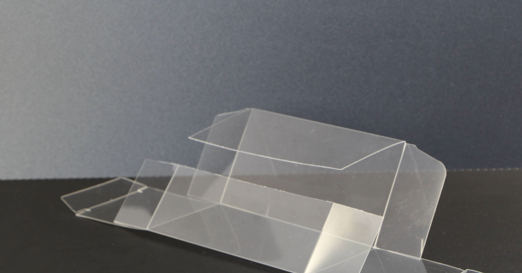 Recycled, transparent folding box with separable seam revealed by ...